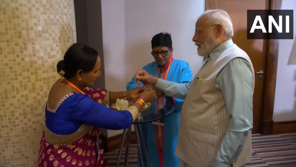 South Africa: Women members of Indian diaspora tie 'Rakhi' to PM Modi ...